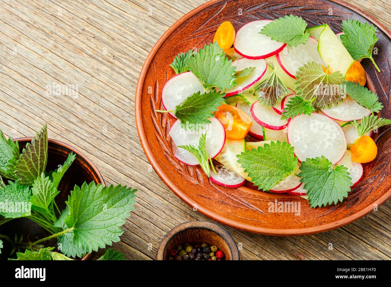 Healthy vegetable salad of nettle on plate Stock Photo - Alamy
