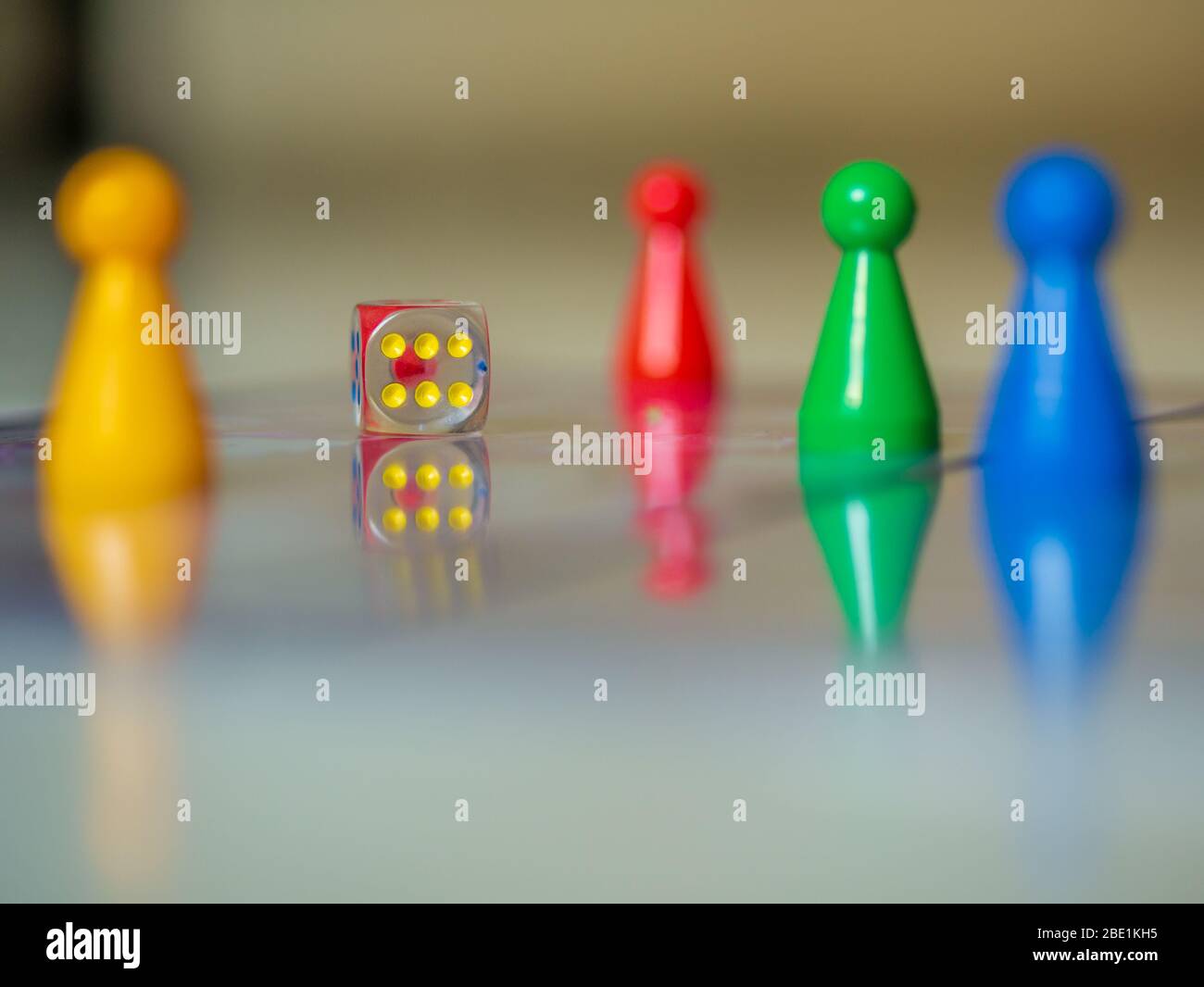 Reflection of Colorful plastic player pawn for boardgame and dice ...