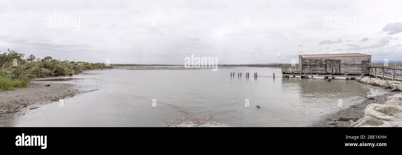 landscape with lagoon and wharf, shot in bright cloudy spring light at ...