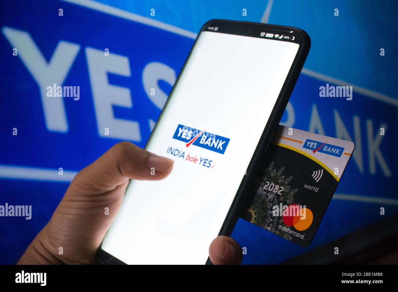 A mobile logged into the yes bank mobile application infront of the yes ...