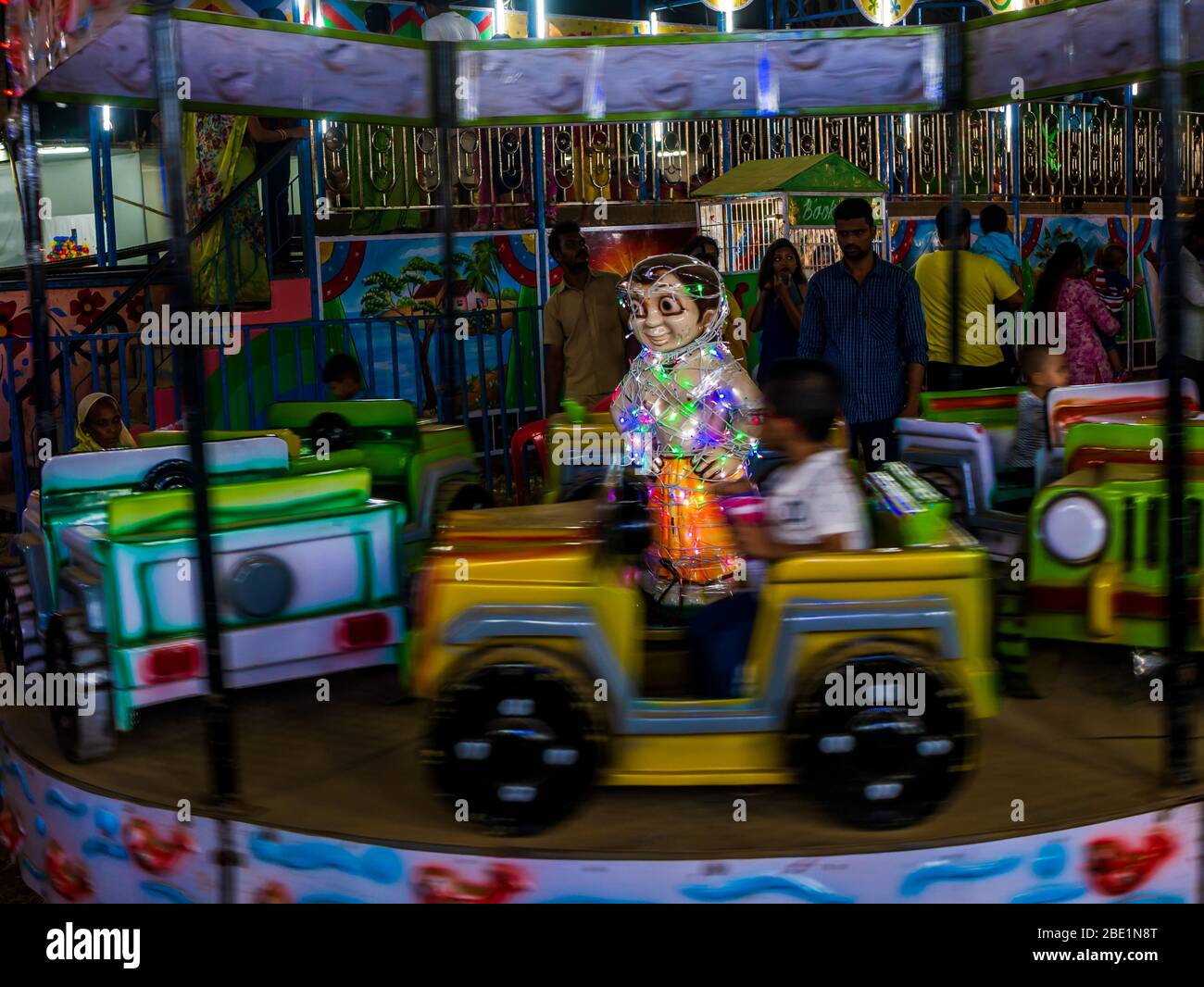 Mumbai, India - December 01, 2019: Indian kids enjoying carousel ride ...