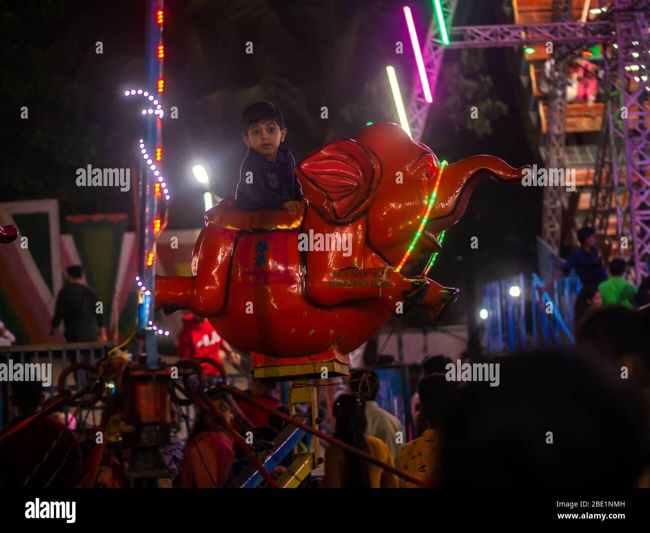 Mumbai, India - December 01, 2019: Indian kids enjoying carousel ride ...