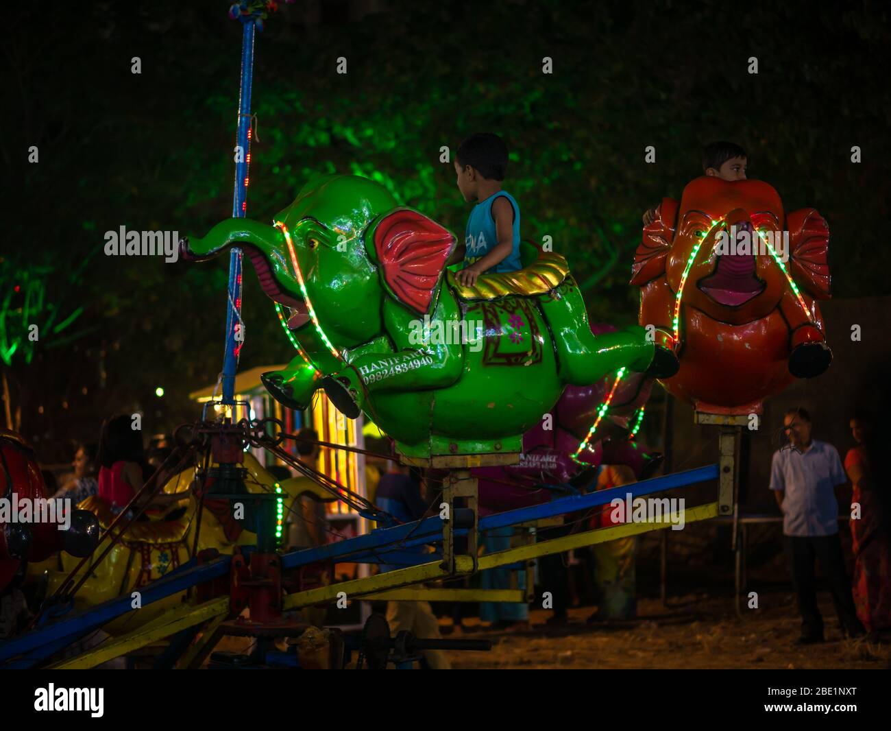India amusement park ride child hi-res stock photography and images - Alamy