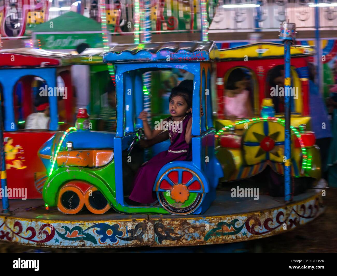 Mumbai, India - December 01, 2019: Indian kid enjoying carousel ride in ...