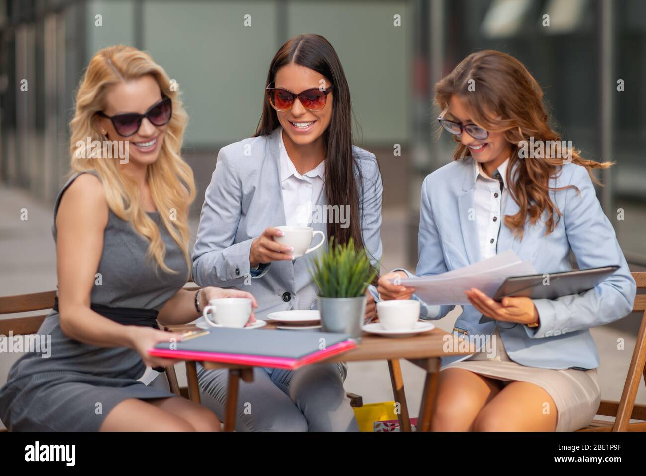 Business meeting in a cafe.Business colleagues relaxing after hard work ...