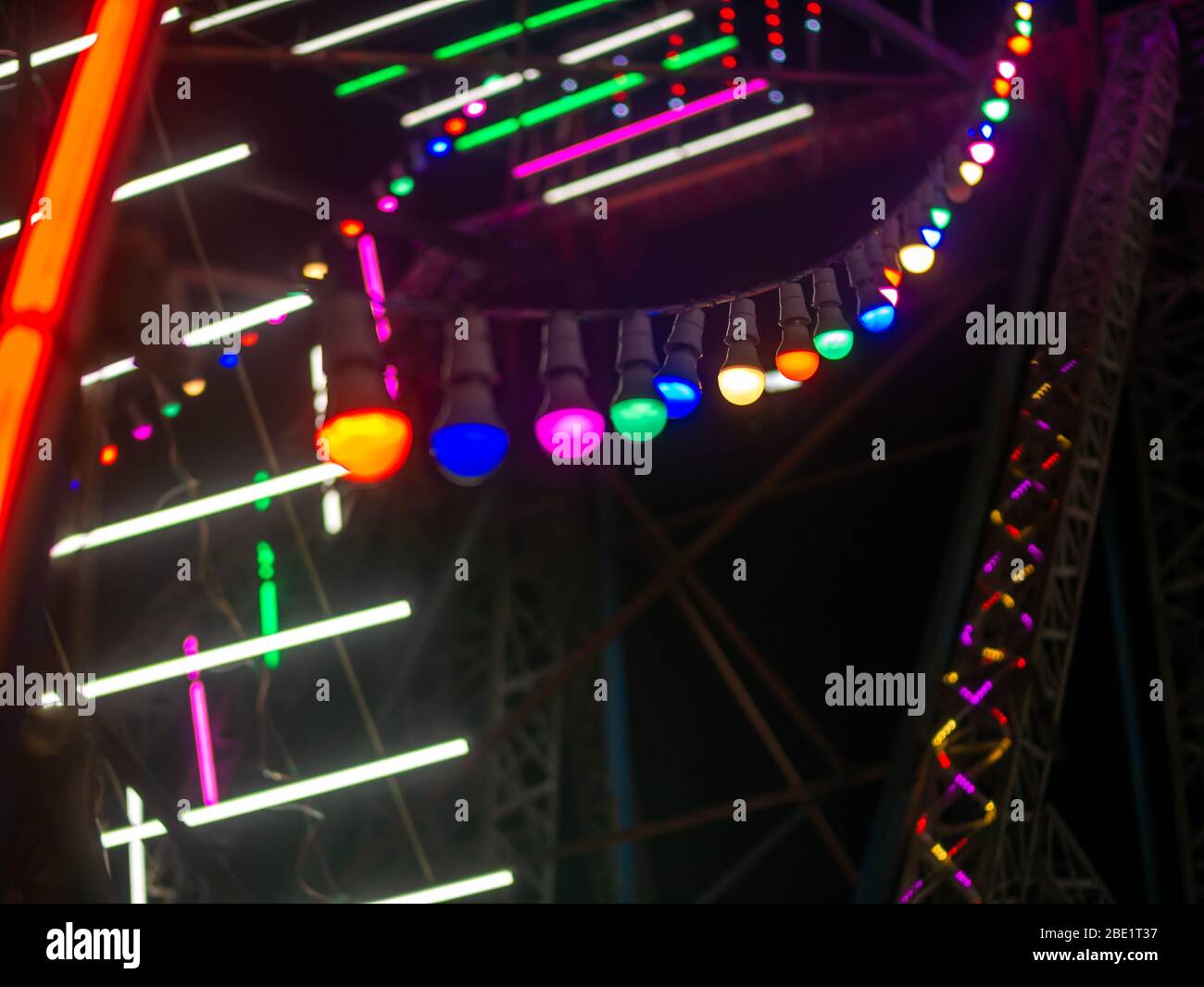 Colourful lights at amusement park in night Stock Photo - Alamy