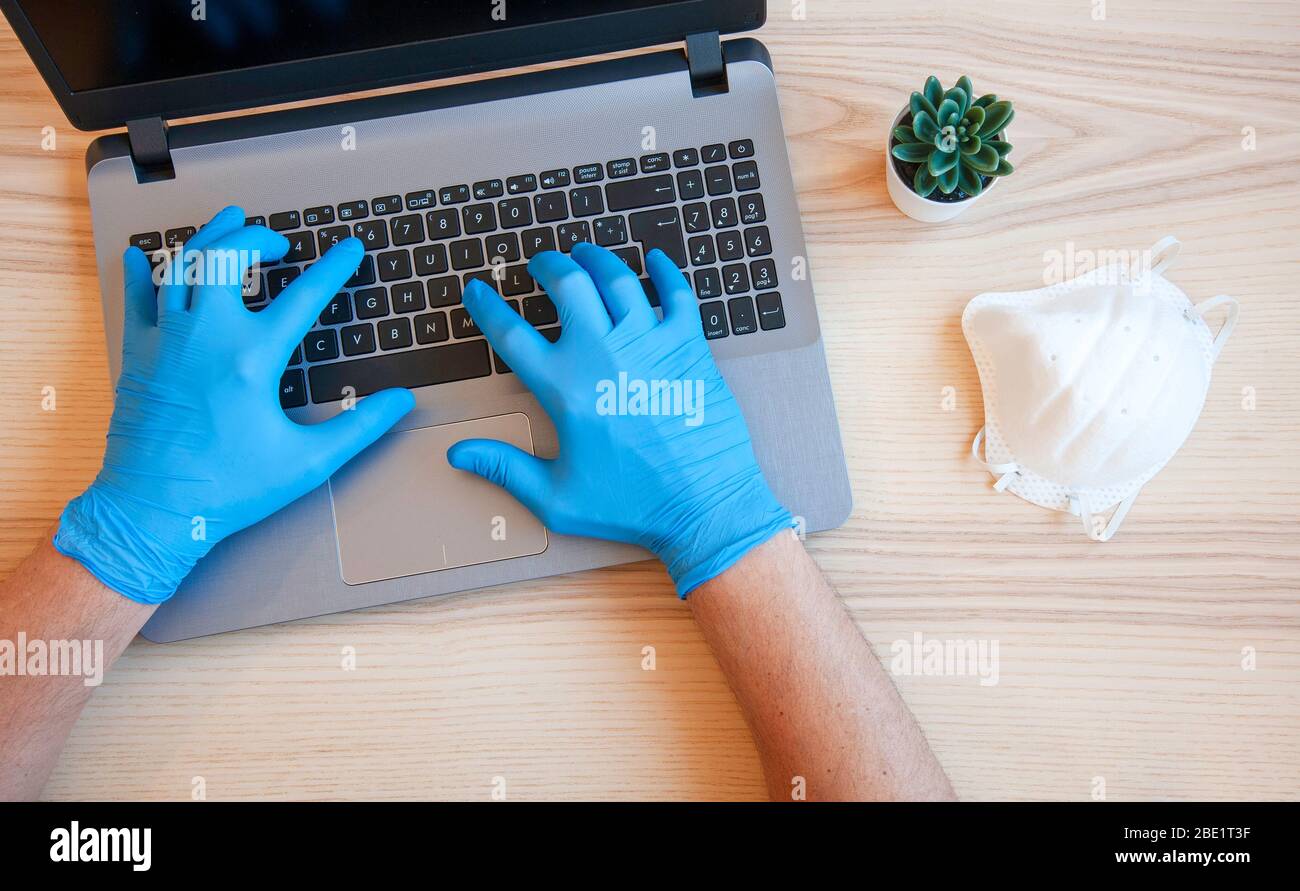 Computer keyboard hands gloves typing hi-res stock photography and ...