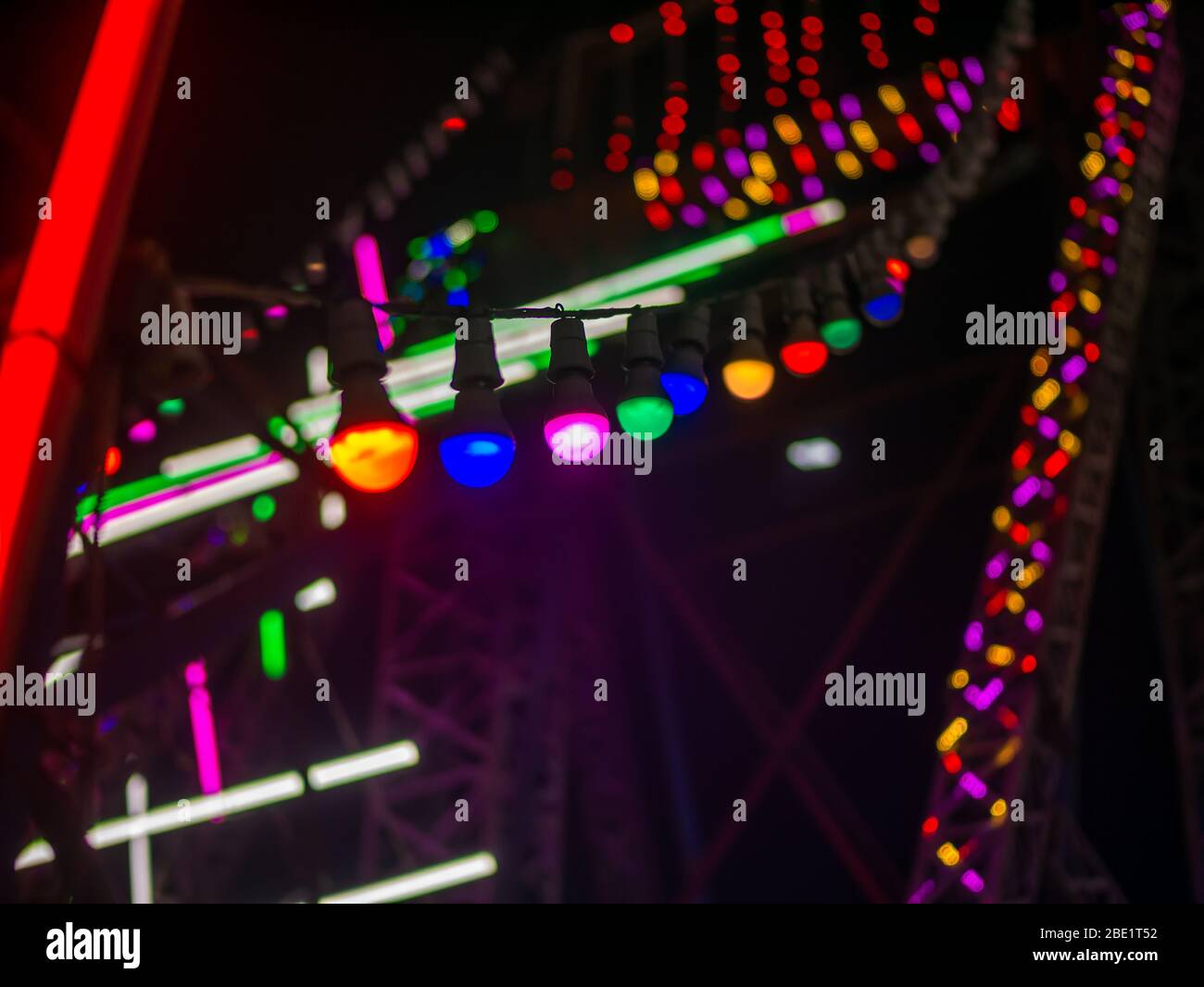 Colourful lights at amusement park in night Stock Photo - Alamy