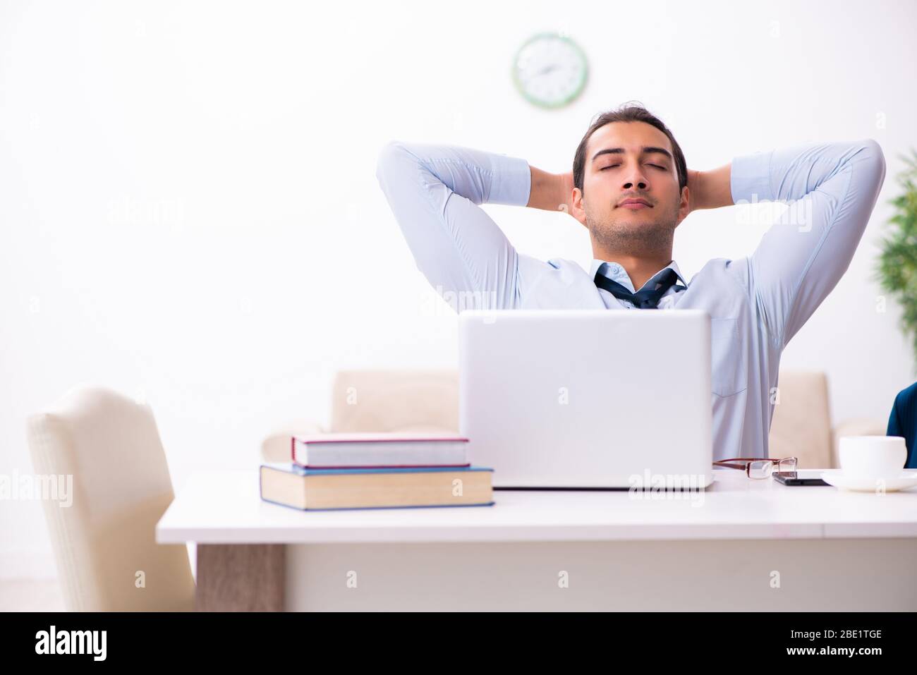 Young employee working from house Stock Photo - Alamy
