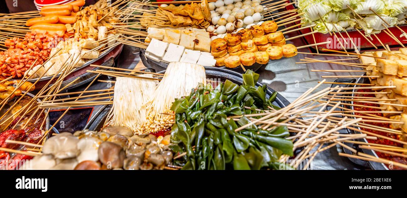 Asian street food. Chinese style street stick food Stock Photo - Alamy
