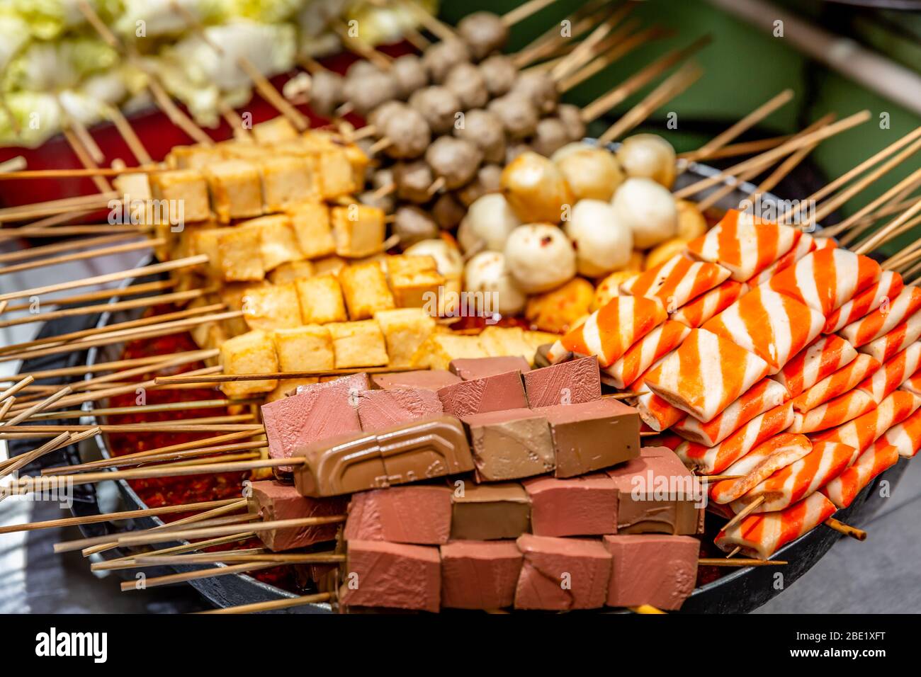 Asian street food. Chinese style street stick food Stock Photo - Alamy