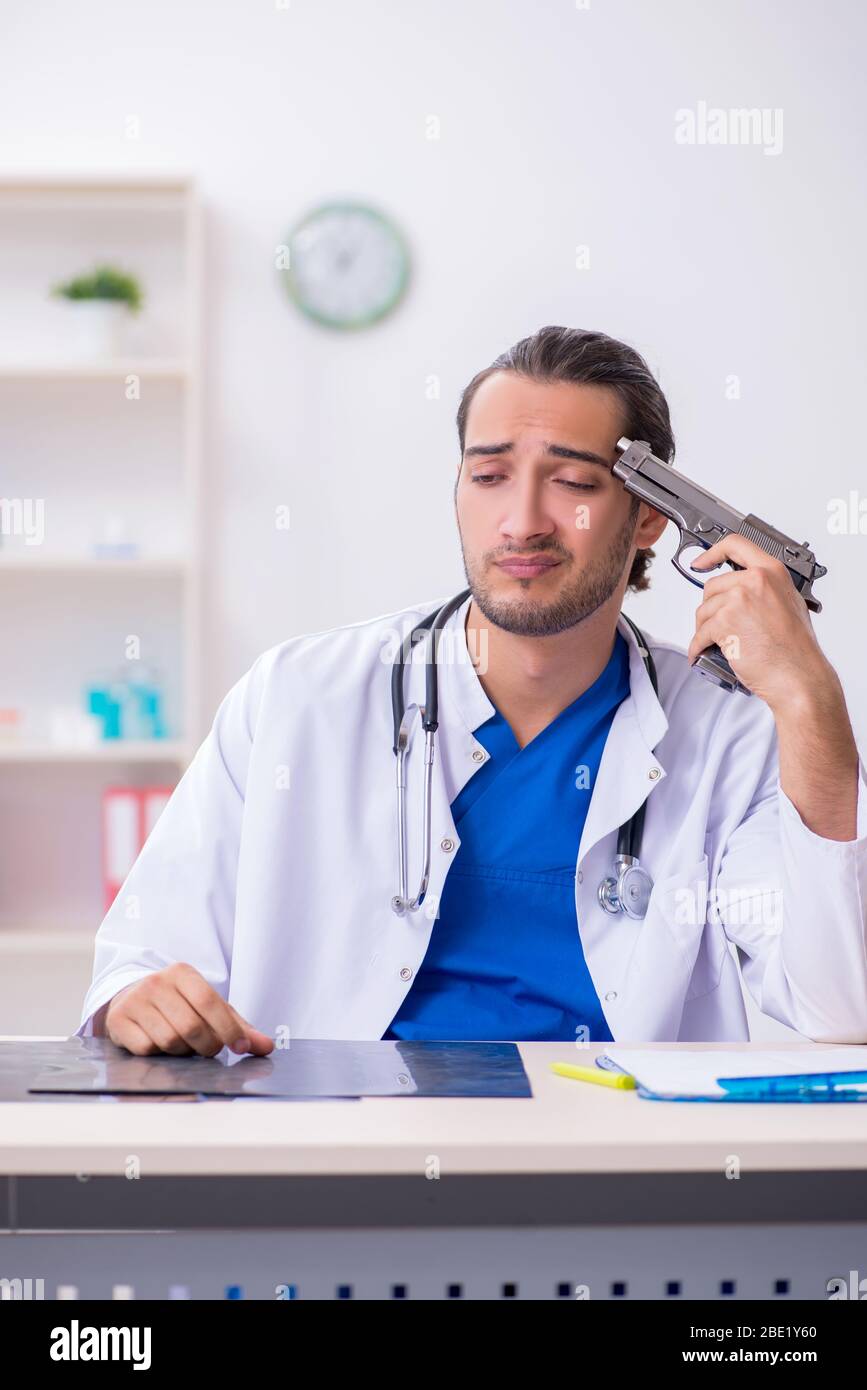 Young doctor being tired after night shift Stock Photo - Alamy