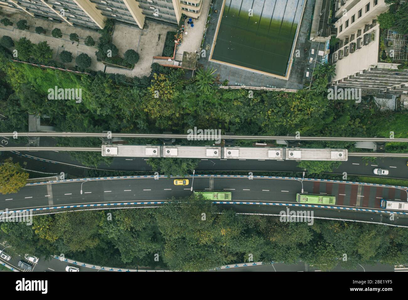 Aerial drone overhead view of Chongqing light rail carriage on rail to ...