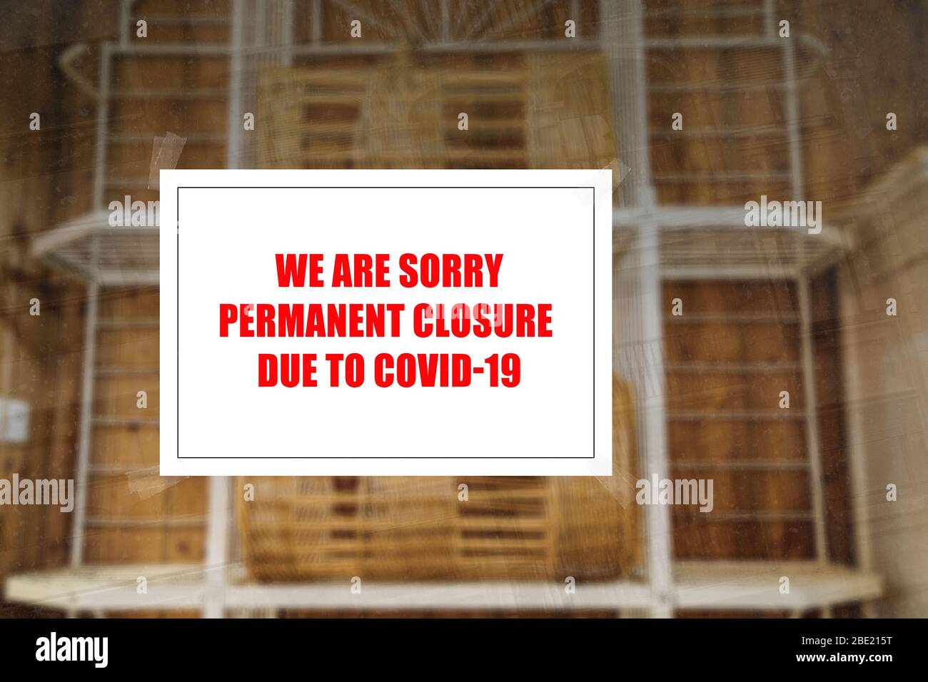 Close-up on a red closed sign in the window of a shop displaying the ...