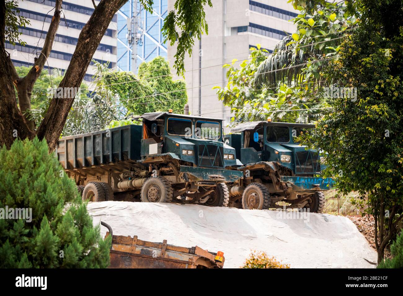 Two large old dark blue turquoise dump trucks tipper from Malaysia ...