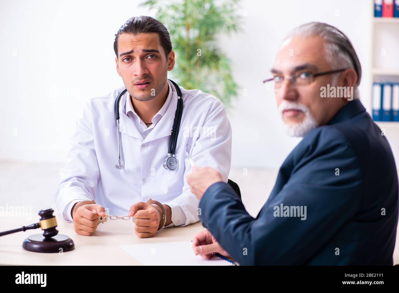 Doctor in courthouse meeting with lawyer Stock Photo - Alamy