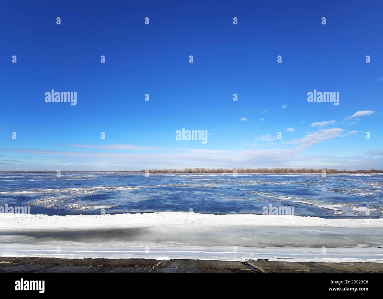 Beautiful early spring river landscape. White clouds over the river and ...