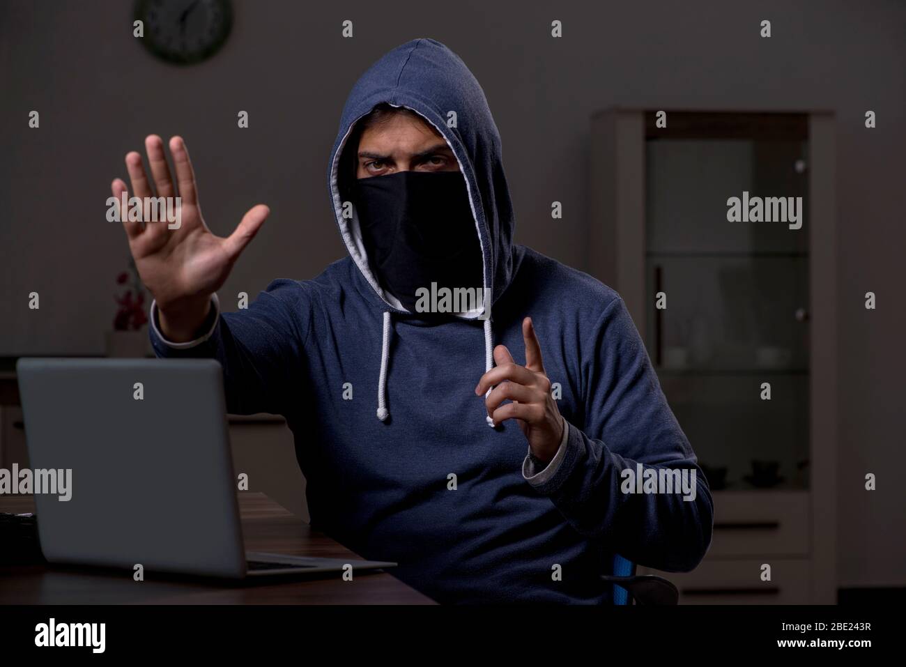 Male hacker hacking security firewall late in the office Stock Photo ...