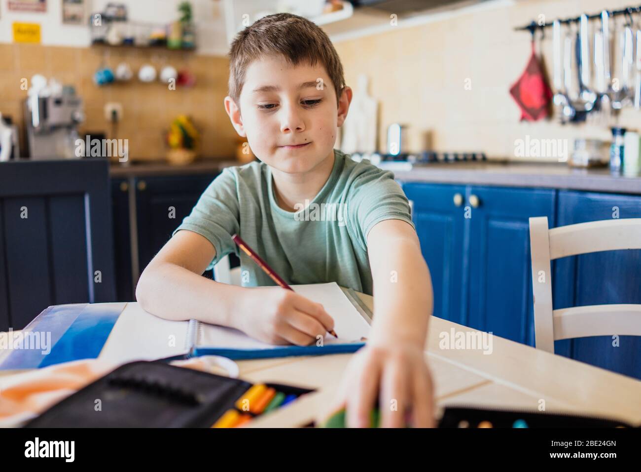 A boy learning at home. Doing homework Stock Photo - Alamy