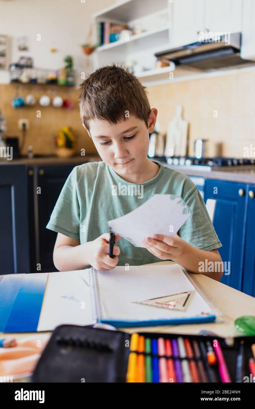 A boy learning at home. Doing homework Stock Photo - Alamy