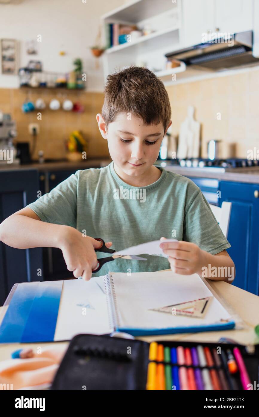 A boy learning at home. Doing homework Stock Photo - Alamy