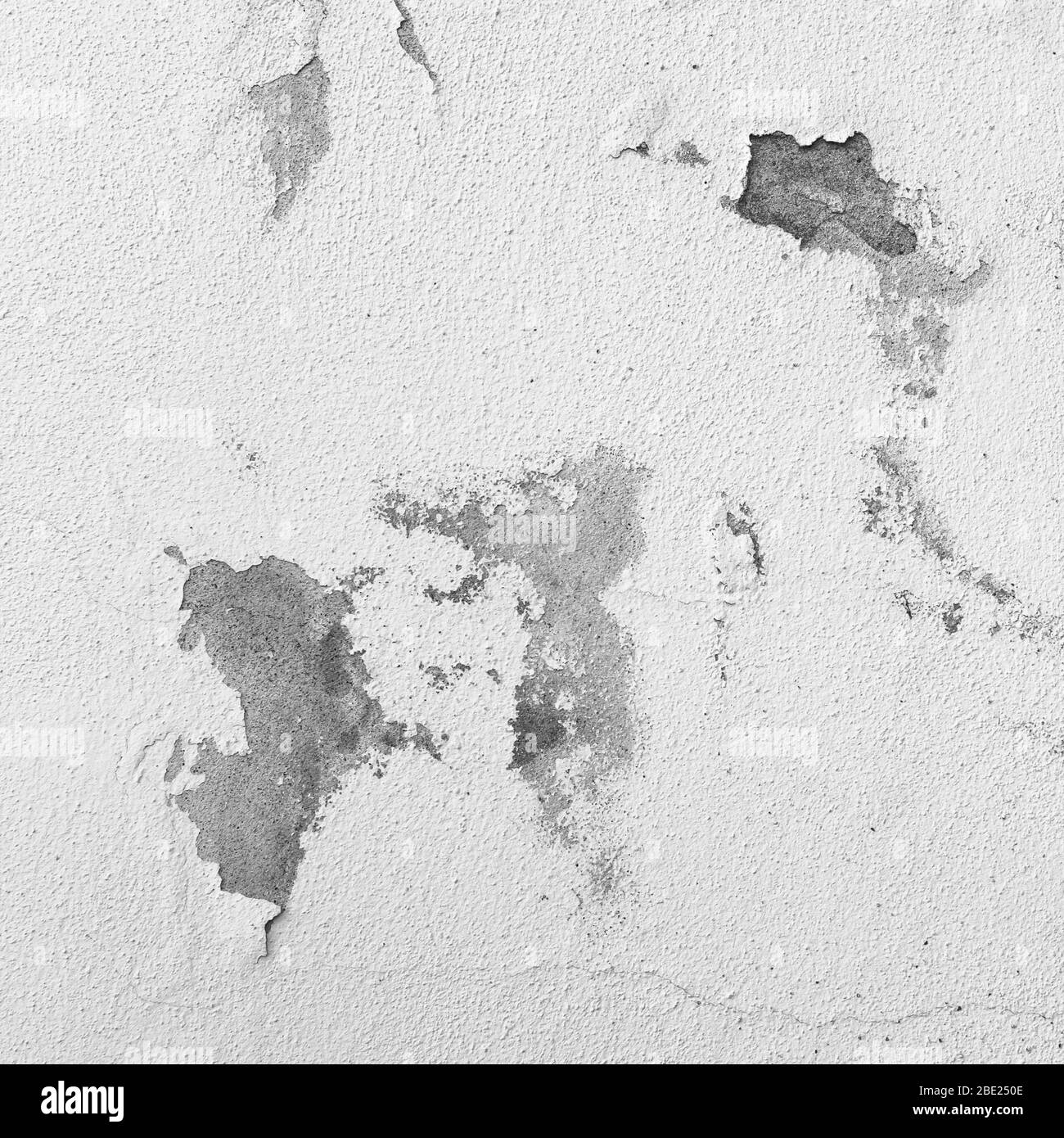 Cracked wall. Paint white peeling off an old interior wall. Ideal for ...