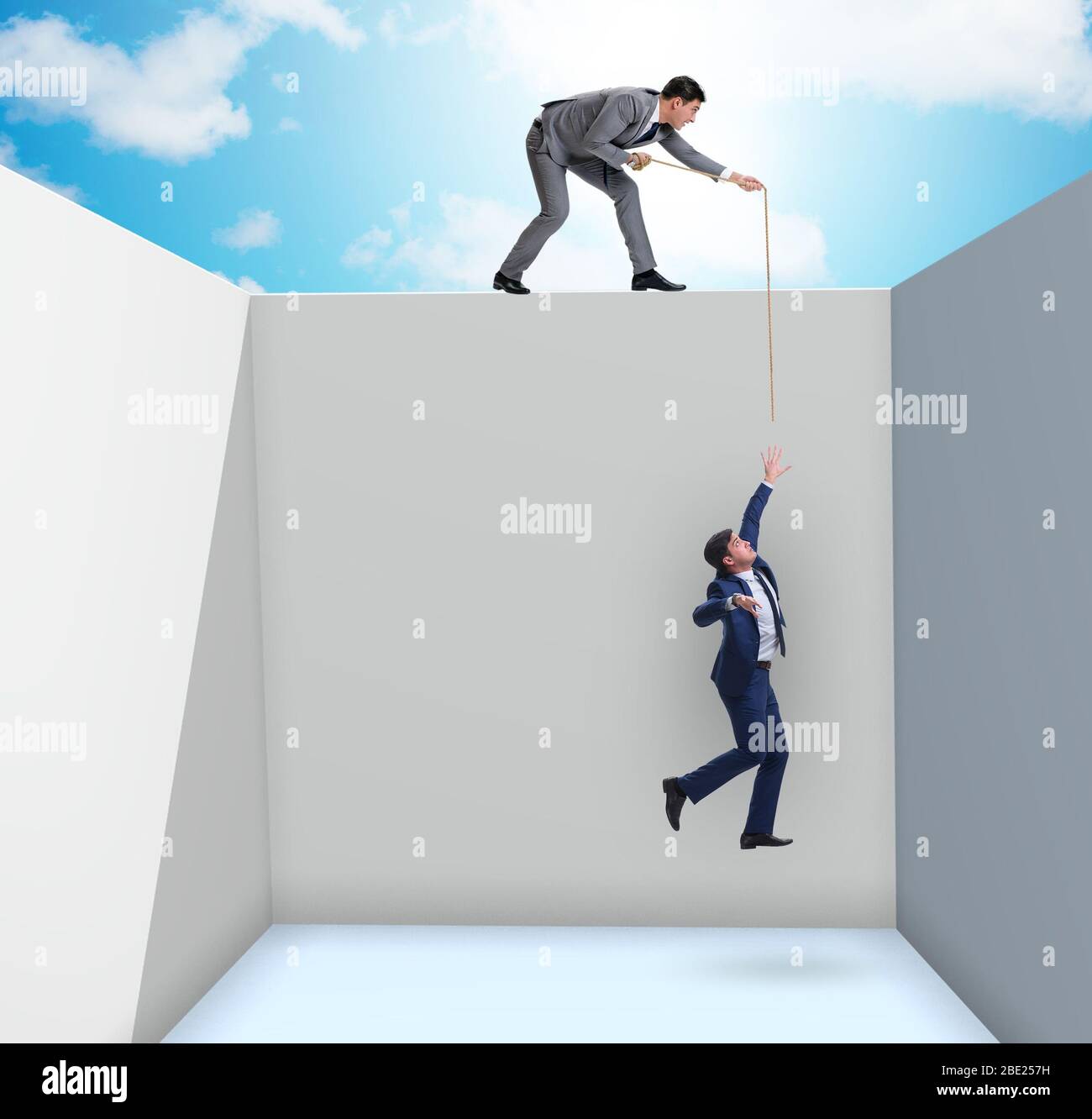 The businessman helping colleague to escape from problems Stock Photo ...