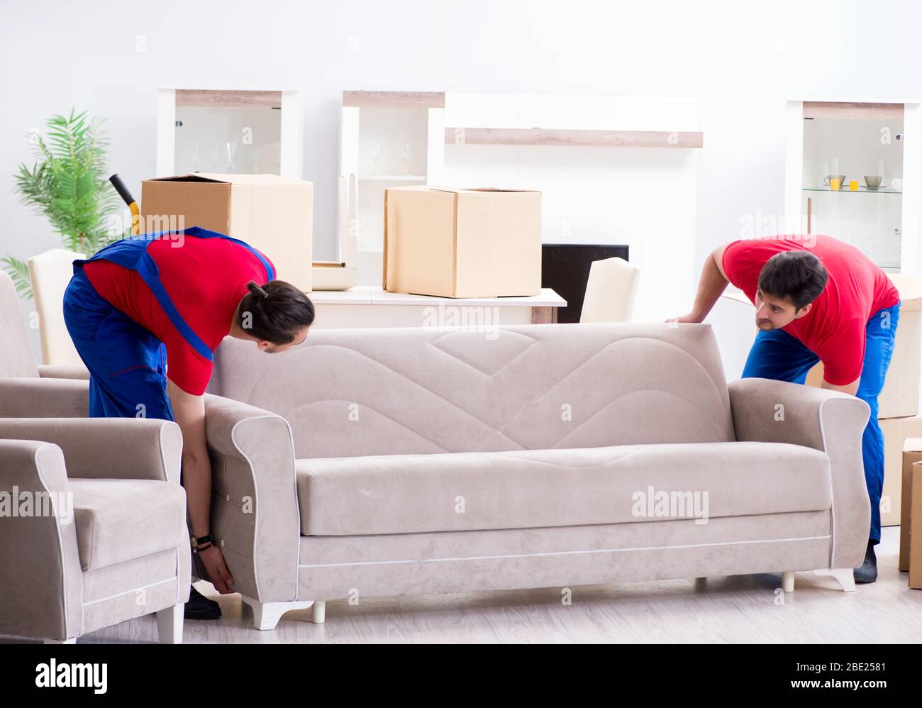 The two contractor employees moving personal belongings Stock Photo - Alamy