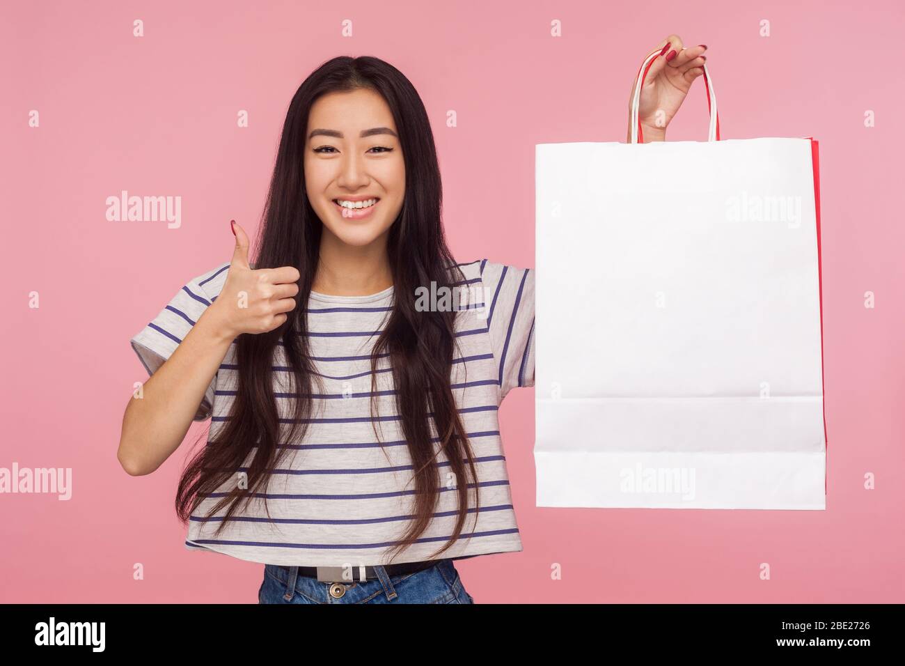 Portrait of satisfied buyer, happy asian woman smiling, showing thumbs ...