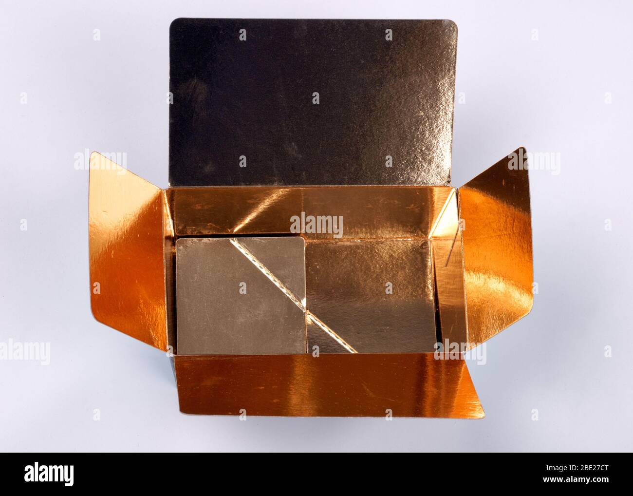 shiny golden empty chocolate box Stock Photo - Alamy