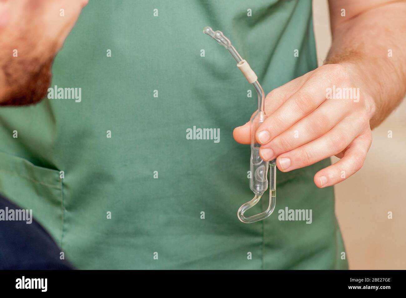 Doctor holds nasal inhalator with essential oil Maholda giving to ...