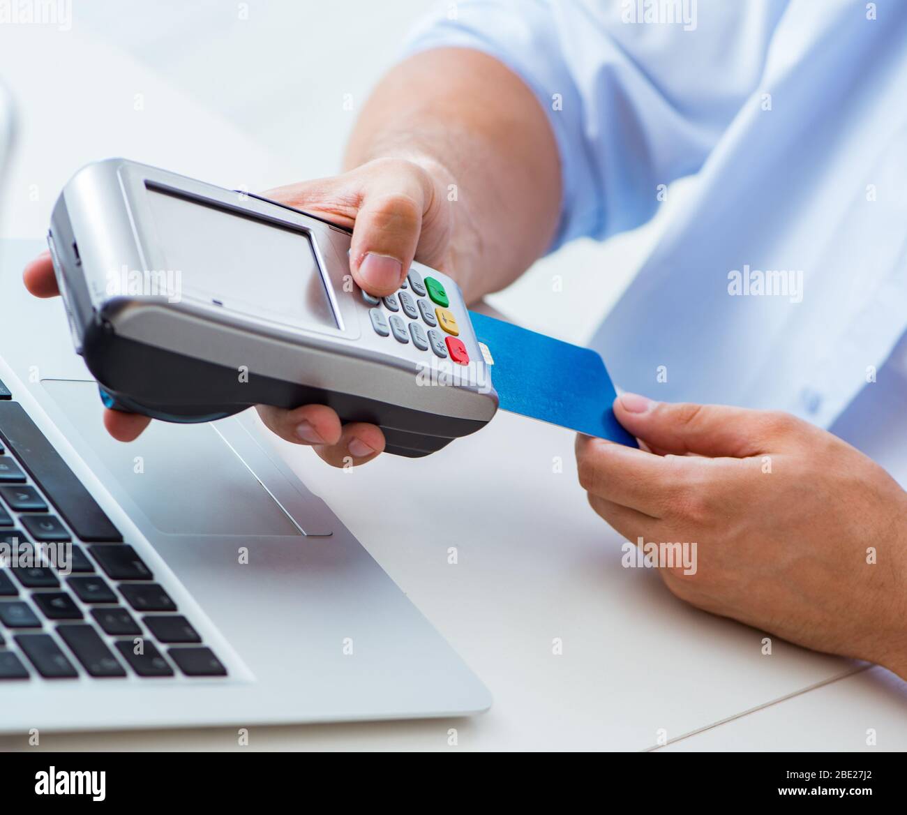 The man processing credit card transaction with pos terminal Stock ...