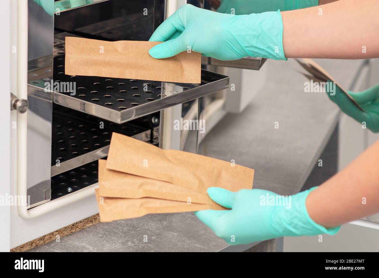 Hands cleans tools of medical instruments with cleaning systems ...