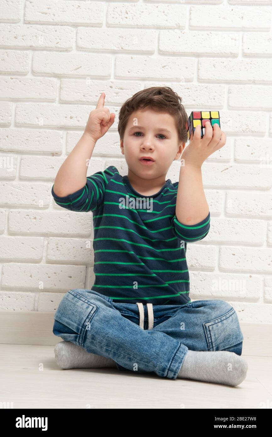 Kiev, Ukraine, 22 march 2020. boy plays with rubik's cube. Rubik's Cube ...