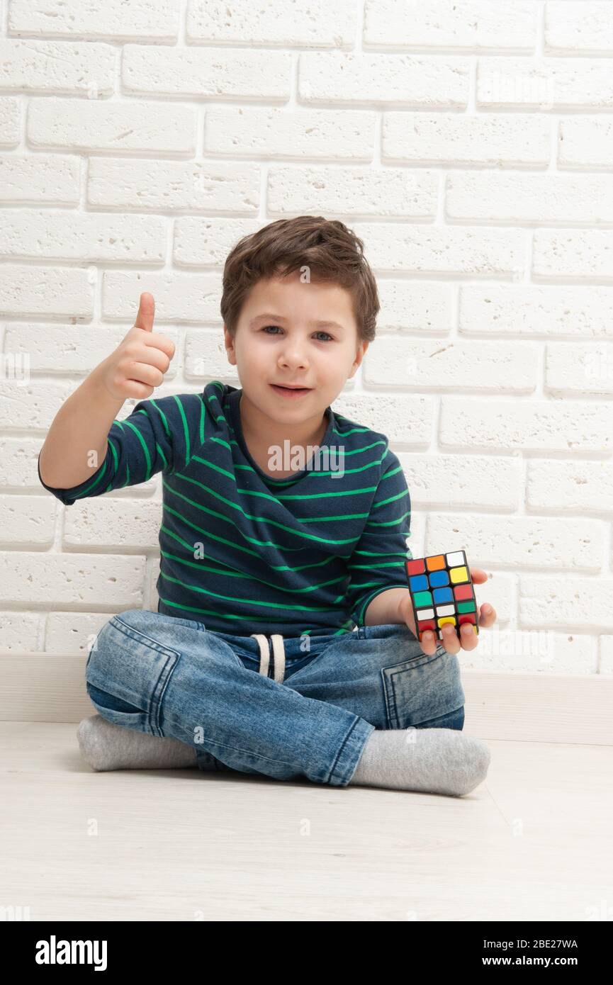 Kiev, Ukraine, 22 march 2020. boy plays with rubik's cube. Rubik's Cube ...
