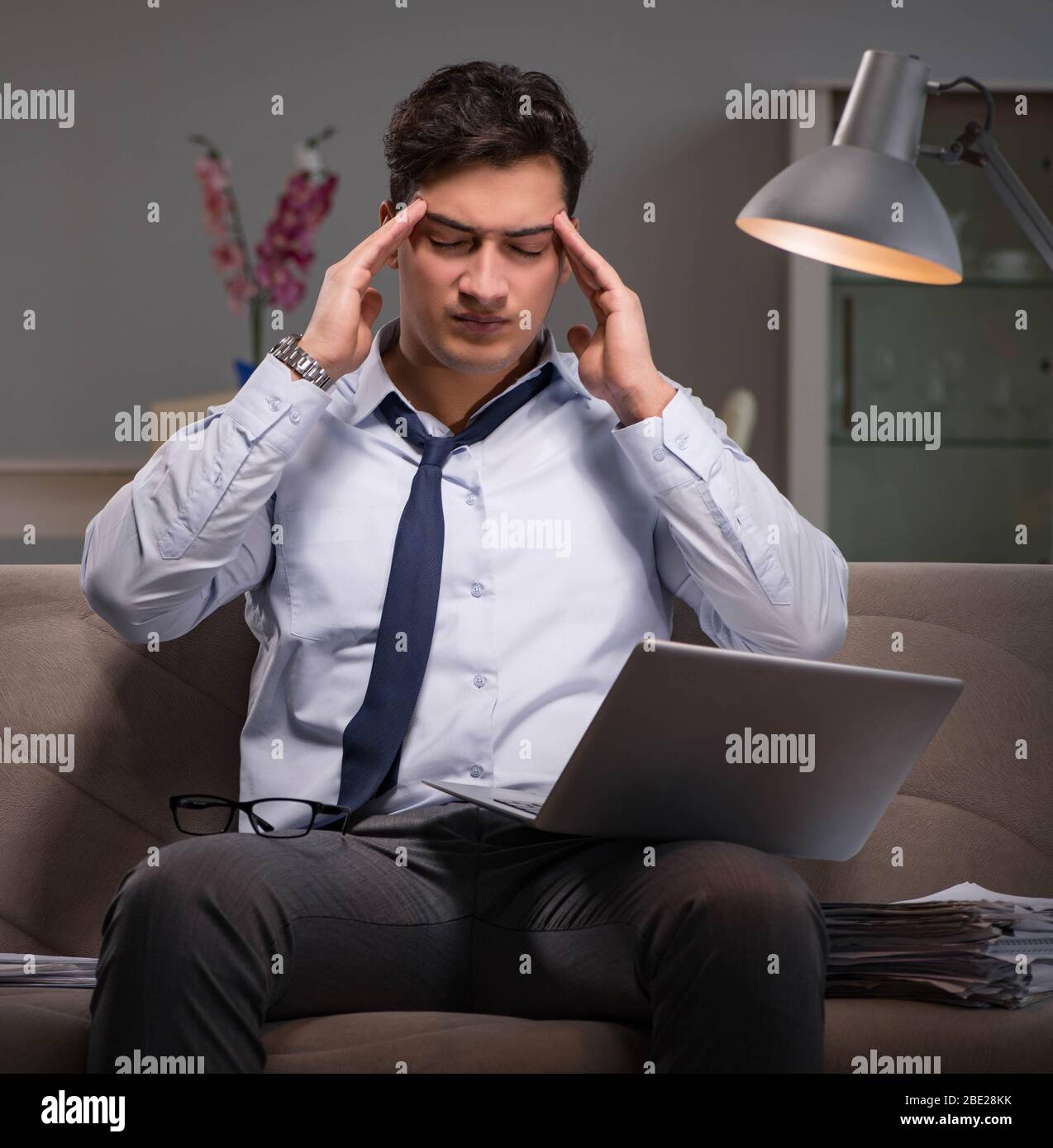 The businessman workaholic working late at home Stock Photo - Alamy