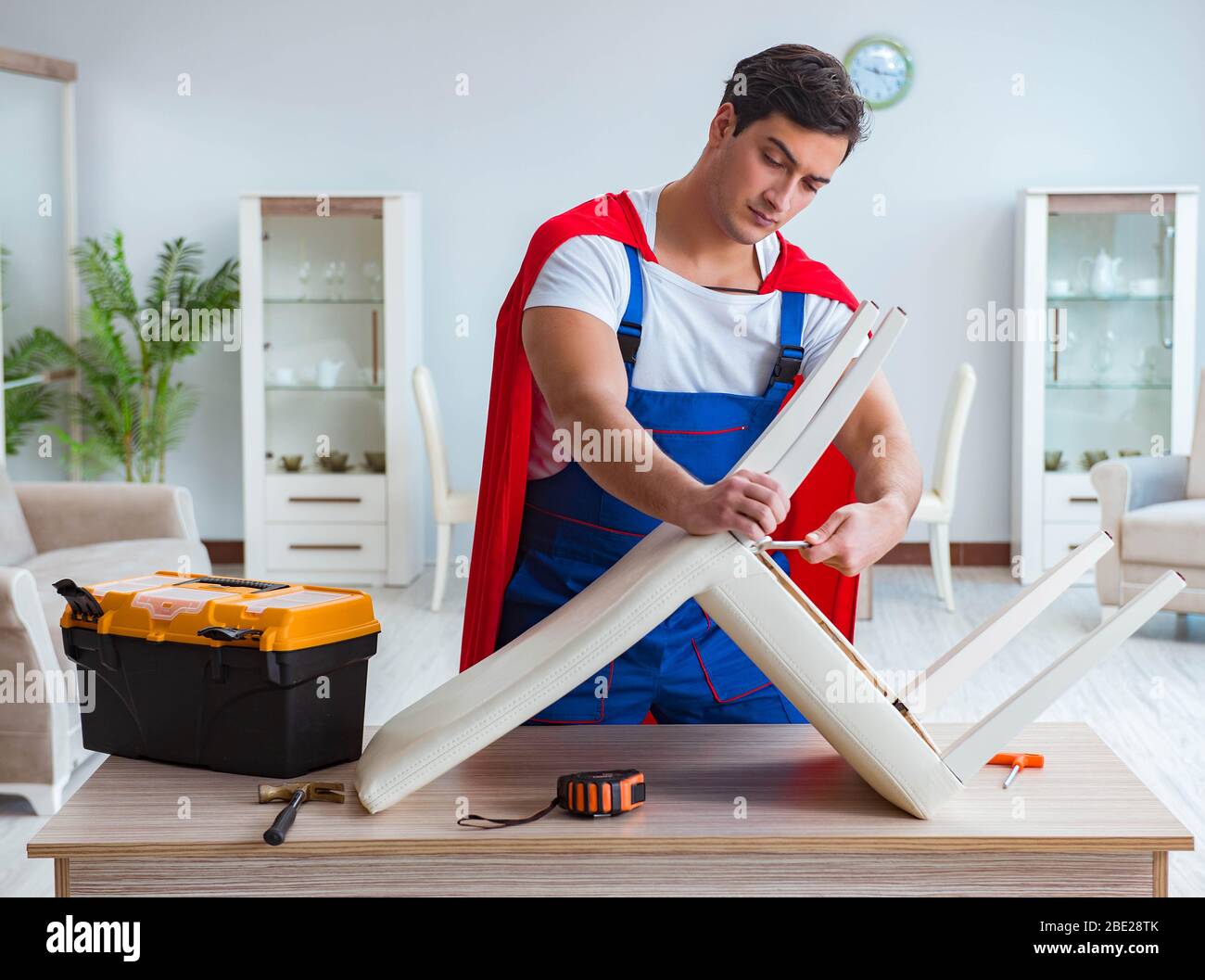 The super hero repairman working at home Stock Photo - Alamy