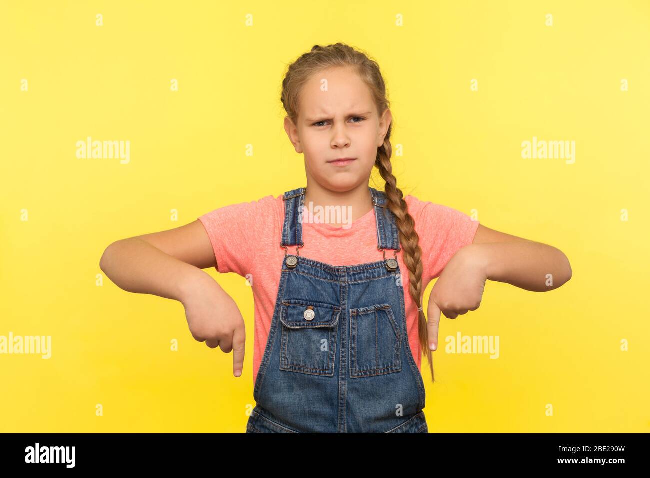 Here and right now! Portrait of naughty bossy little girl with braid in ...