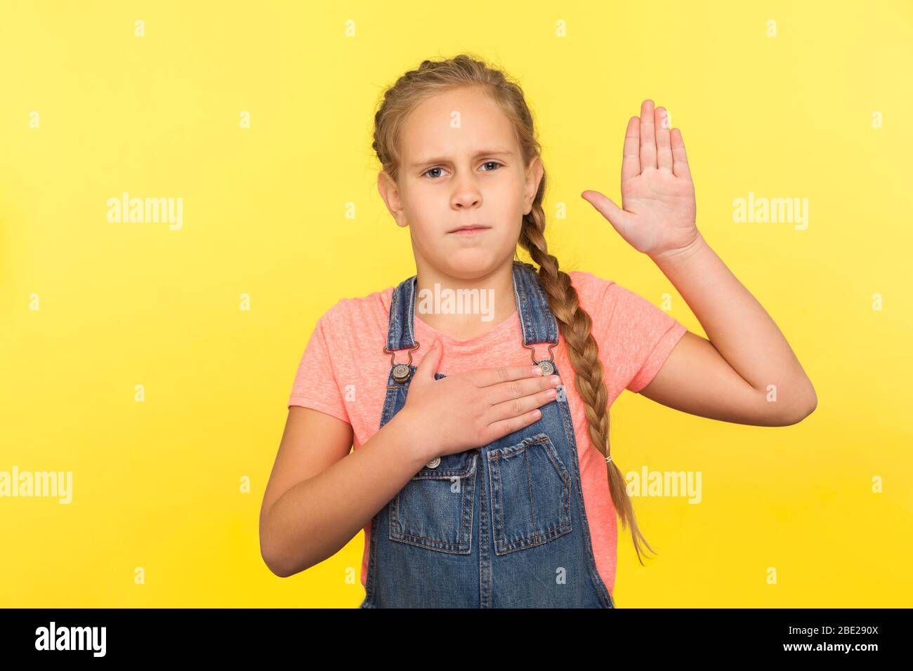 I promise to be honest! Portrait of serious responsible little girl ...