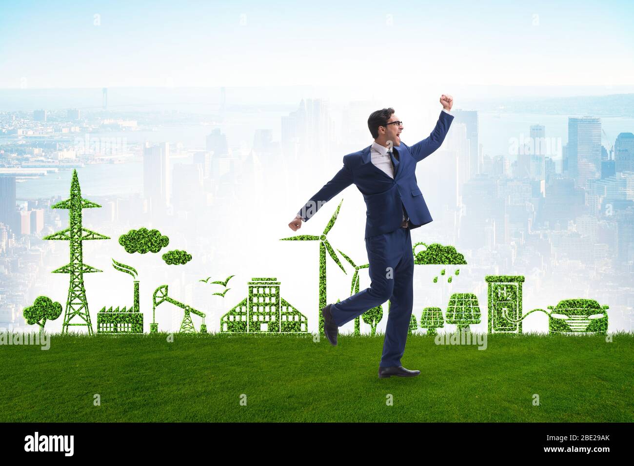 Businessman in green and the environmental concept Stock Photo - Alamy