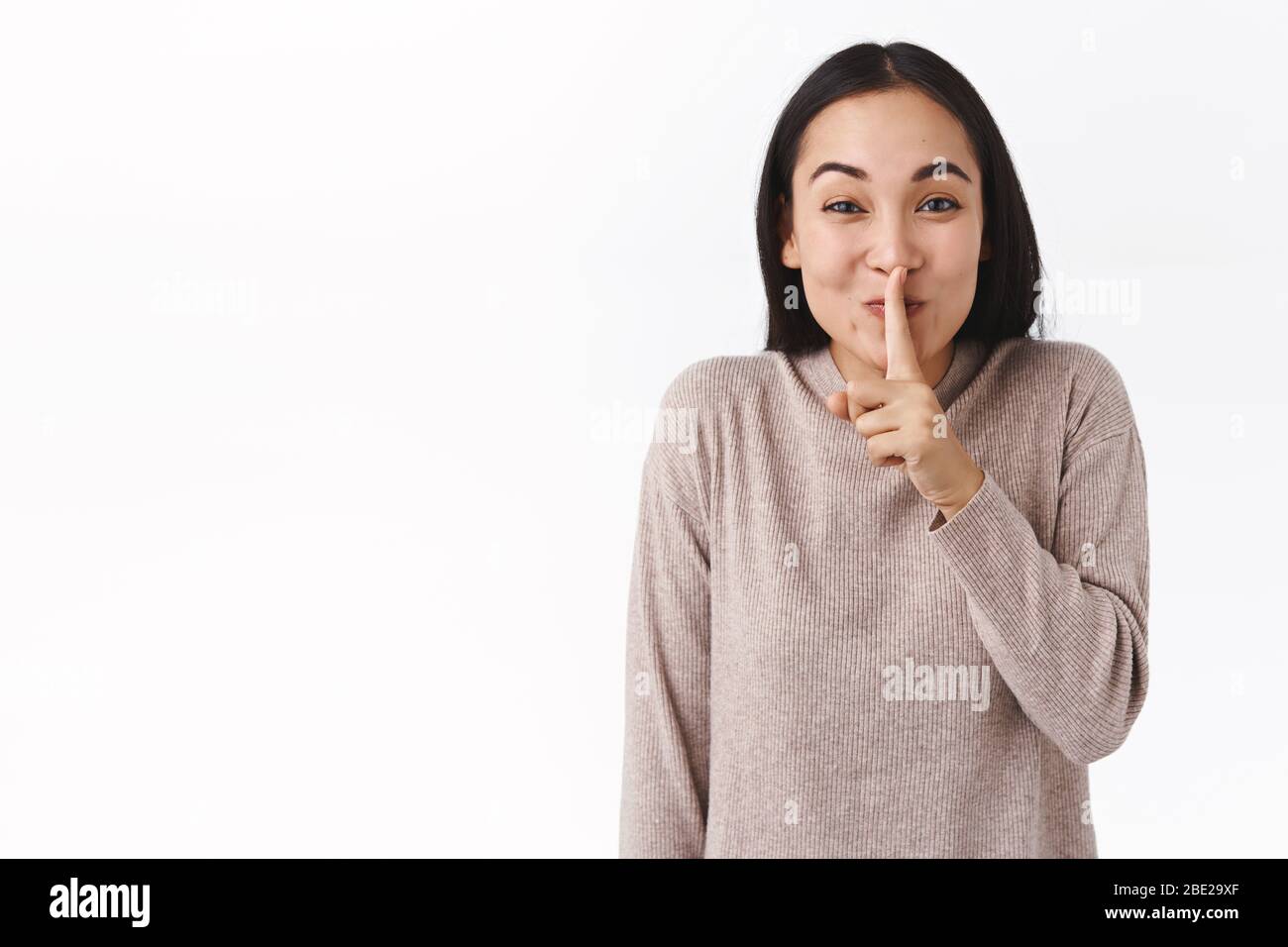 Woman shush laughing hi-res stock photography and images - Alamy