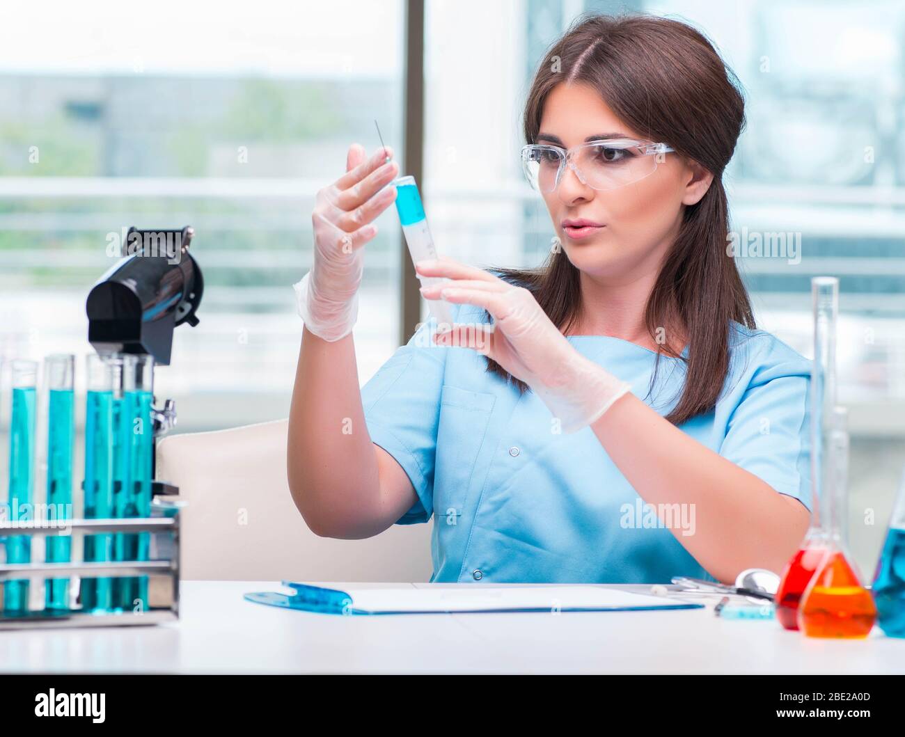 The young female doctor working in the lab Stock Photo - Alamy