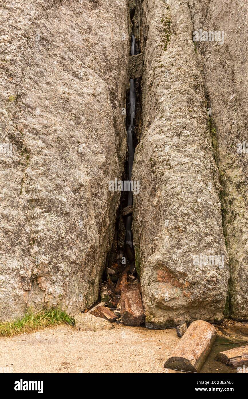 Waterfall Inside A Crack In A Rock Stock Photo - Alamy