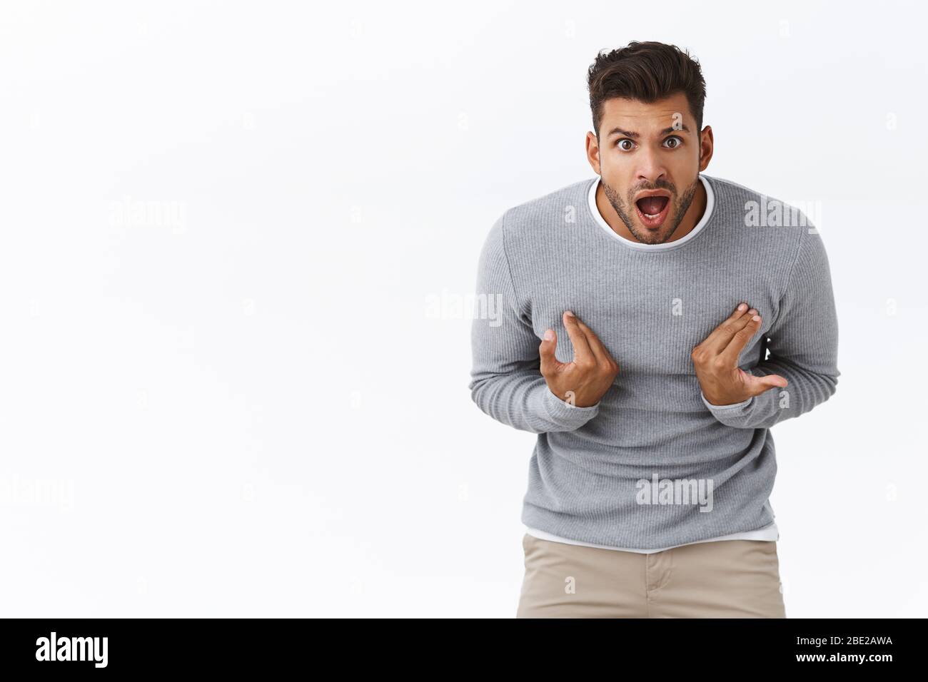 You talking to me. Handsome man with displeased expression accused ...