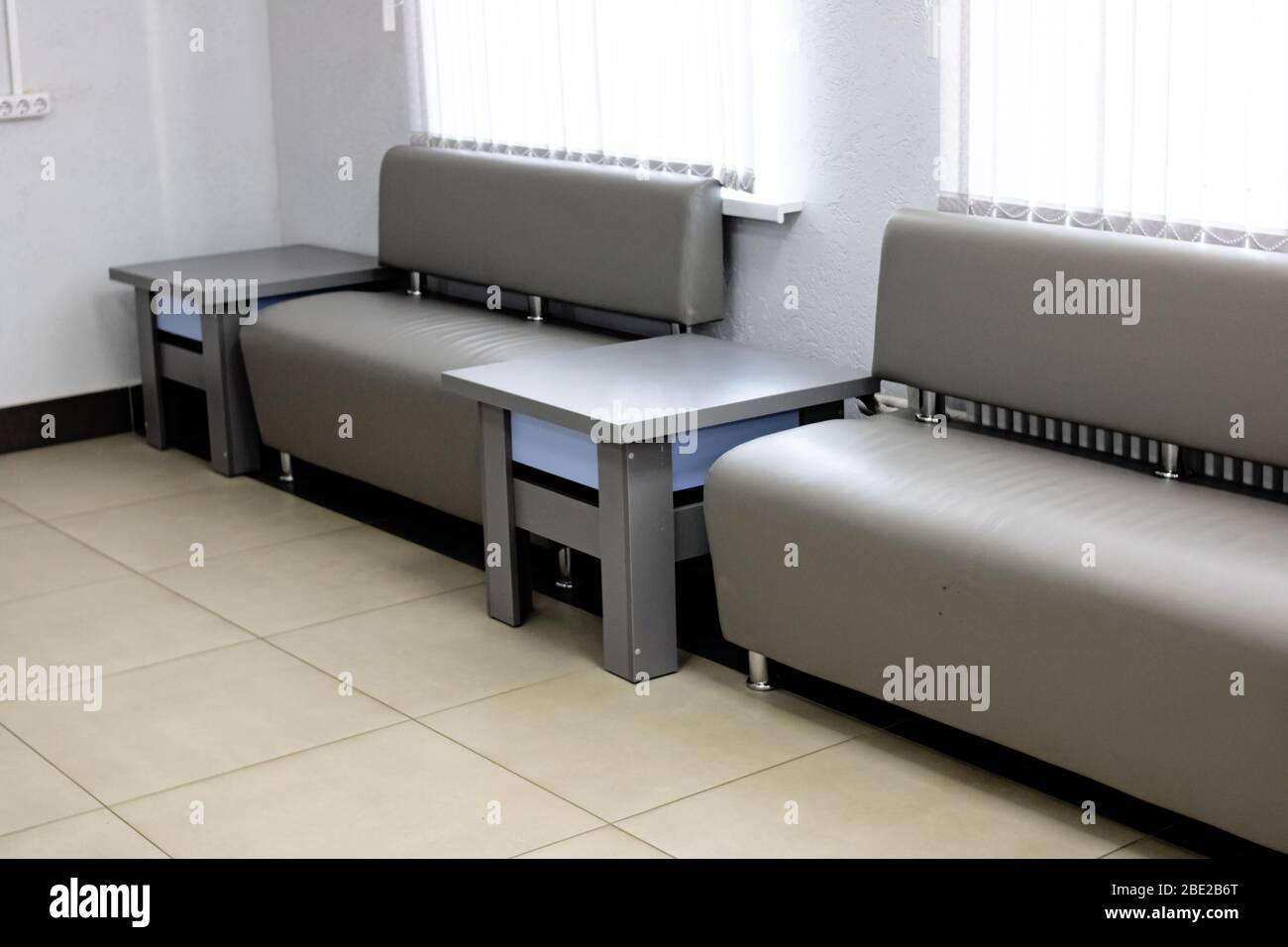 Sofas and tables in the waiting room Stock Photo - Alamy
