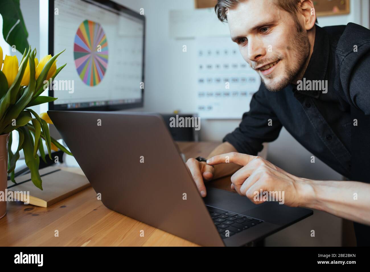 Passionate Man Working remotely. Business owner working laptop from ...