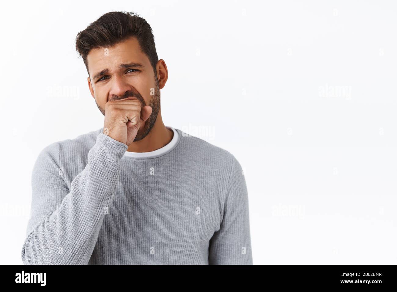 Handsome guy being bored talking with stranger about random staff ...