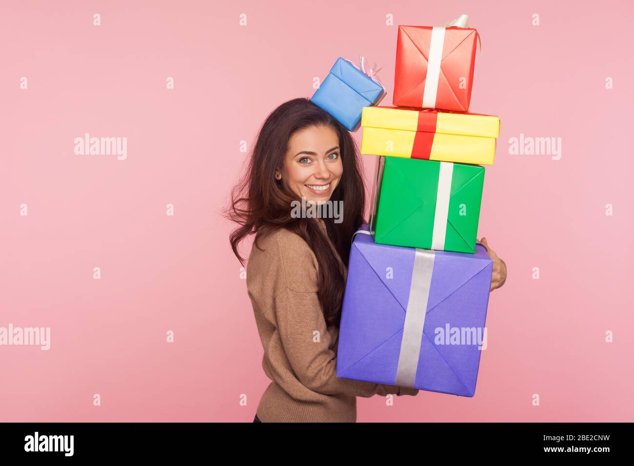 Portrait of happy pretty young woman smiling pleased to camera and ...