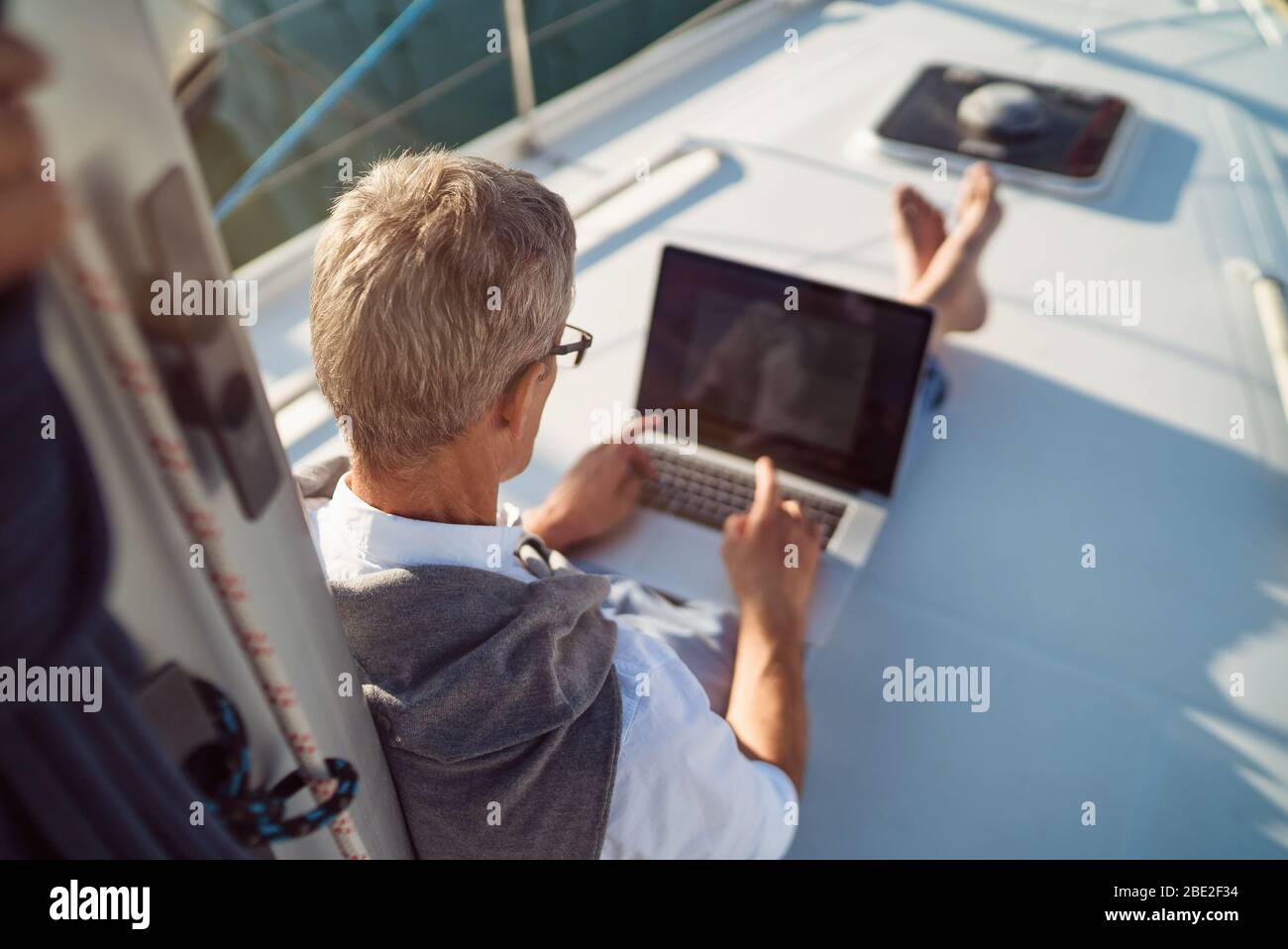 Businessman working computer on boat hi-res stock photography and ...