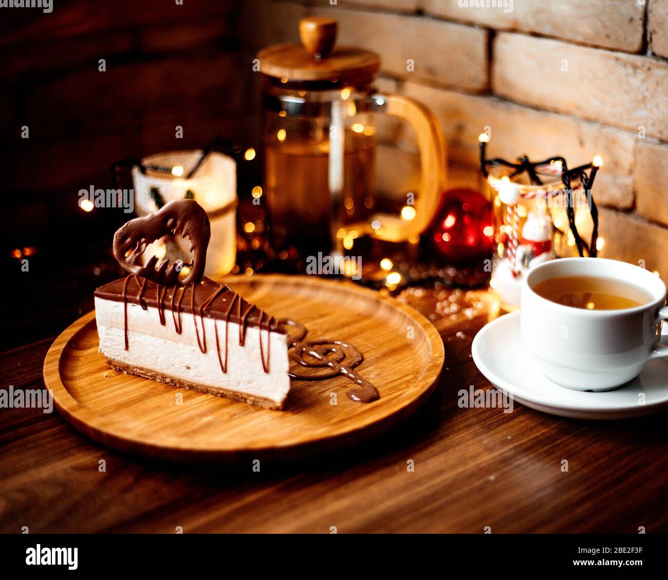 chocolate cheesecake and a cup of flavored tea Stock Photo - Alamy